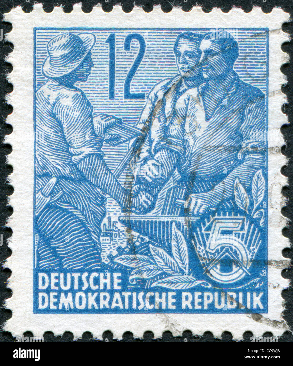 DDR - CIRCA 1953: A stamp printed in DDR, shown Worker, peasant and ...