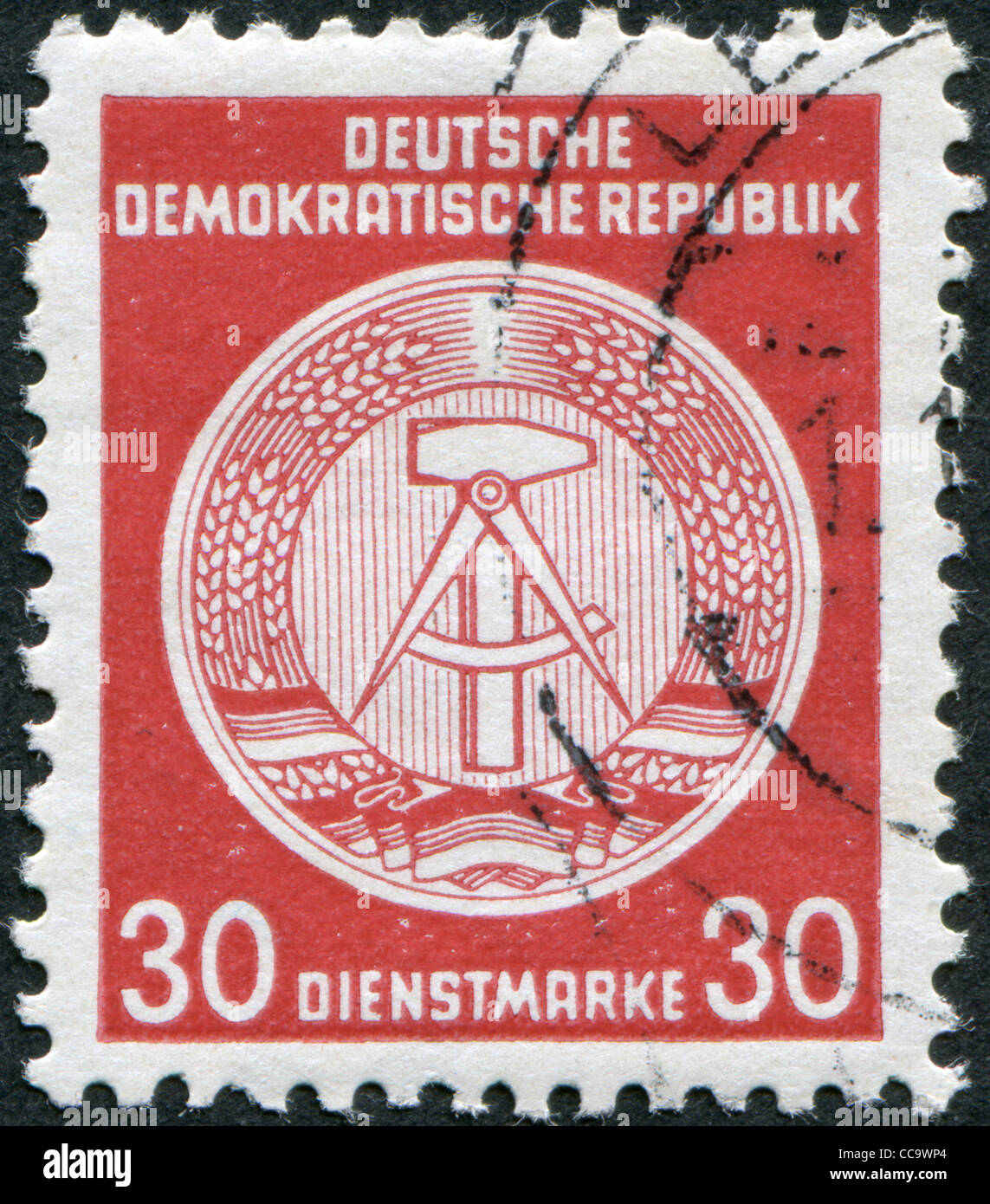 DDR - CIRCA 1954: A stamp printed in DDR, coat of arms shows the DDR ...
