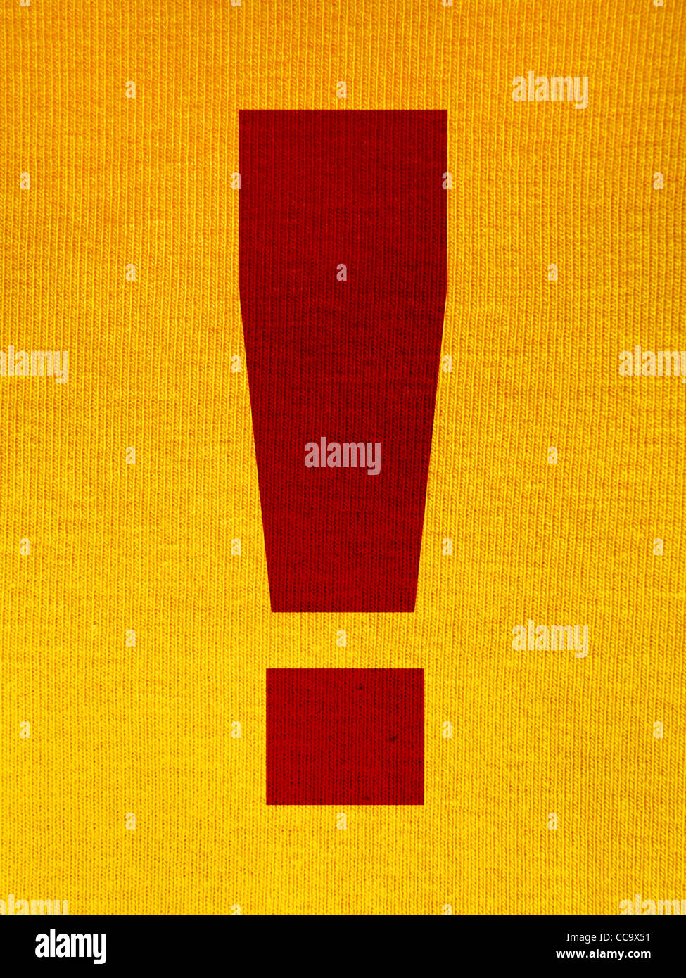 Exclamation point over a yellow tissue background Stock Photo - Alamy