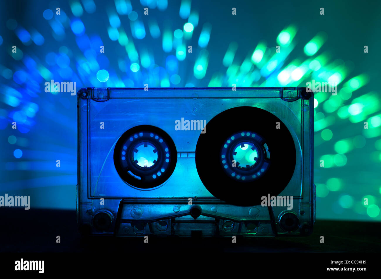 Transparent Cassette tape and blue color disco light background Stock ...