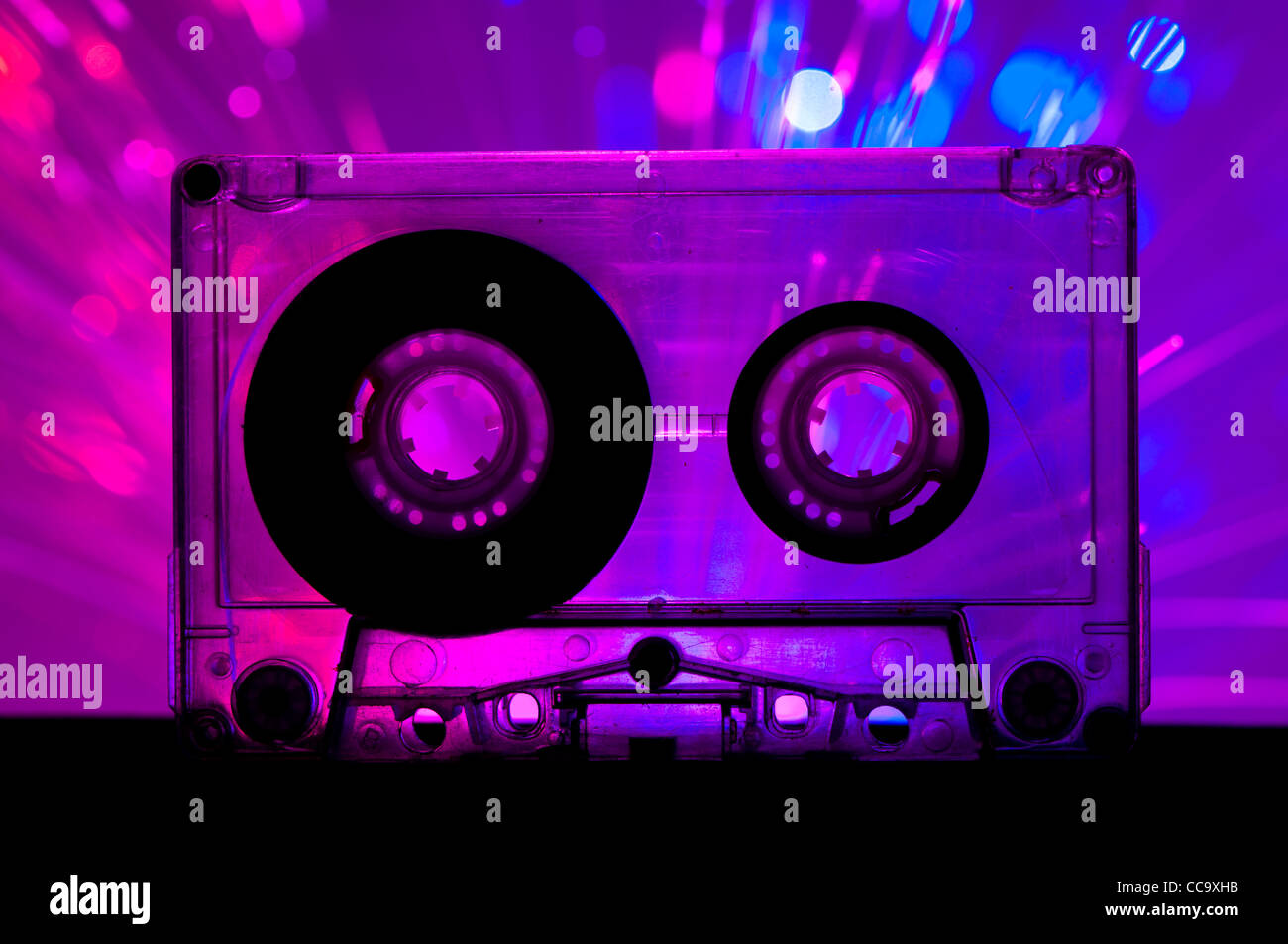 Transparent Cassette tape and blue pink color disco light background ...