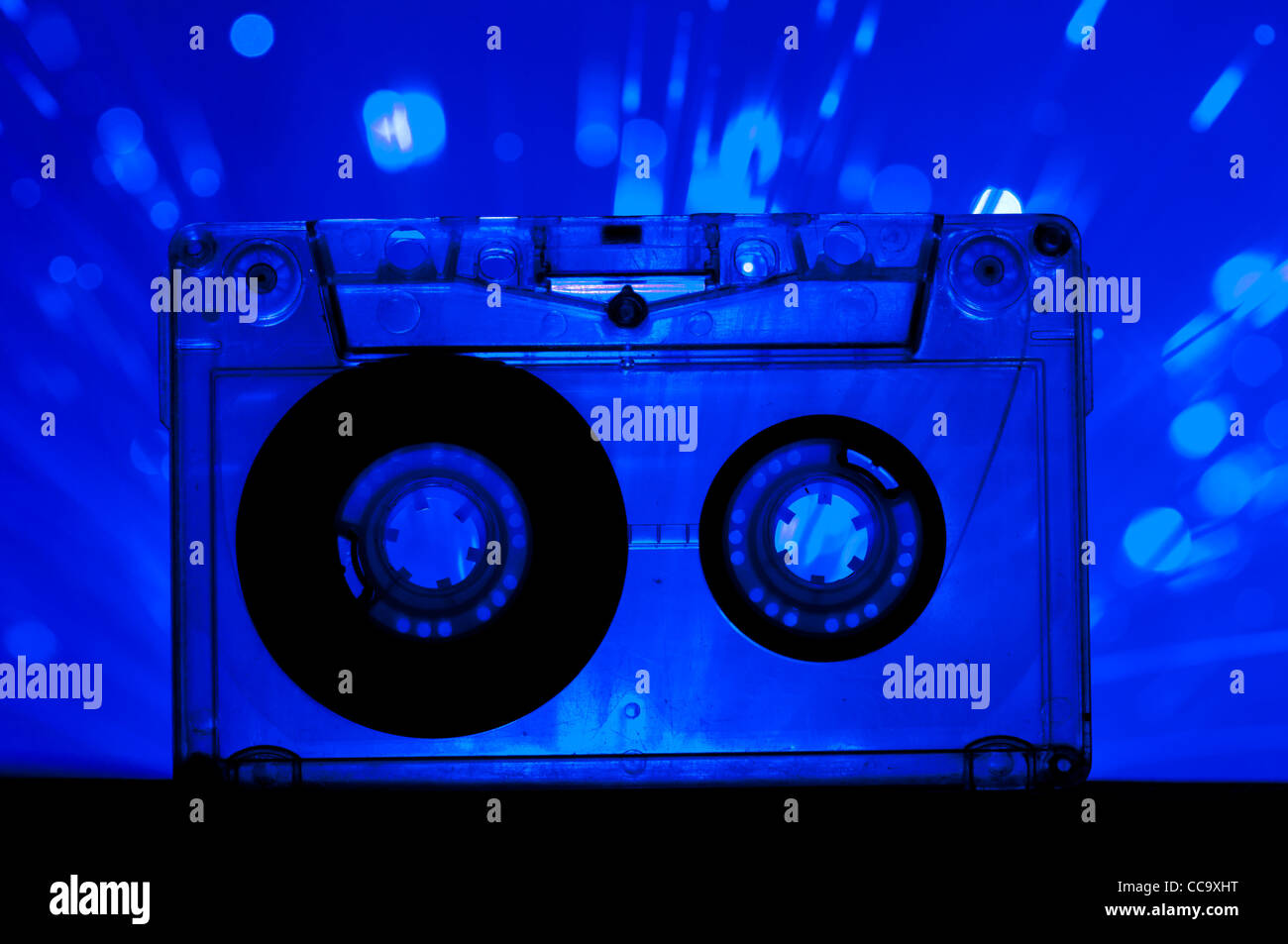 Transparent Cassette tape and blue color disco light background Stock ...