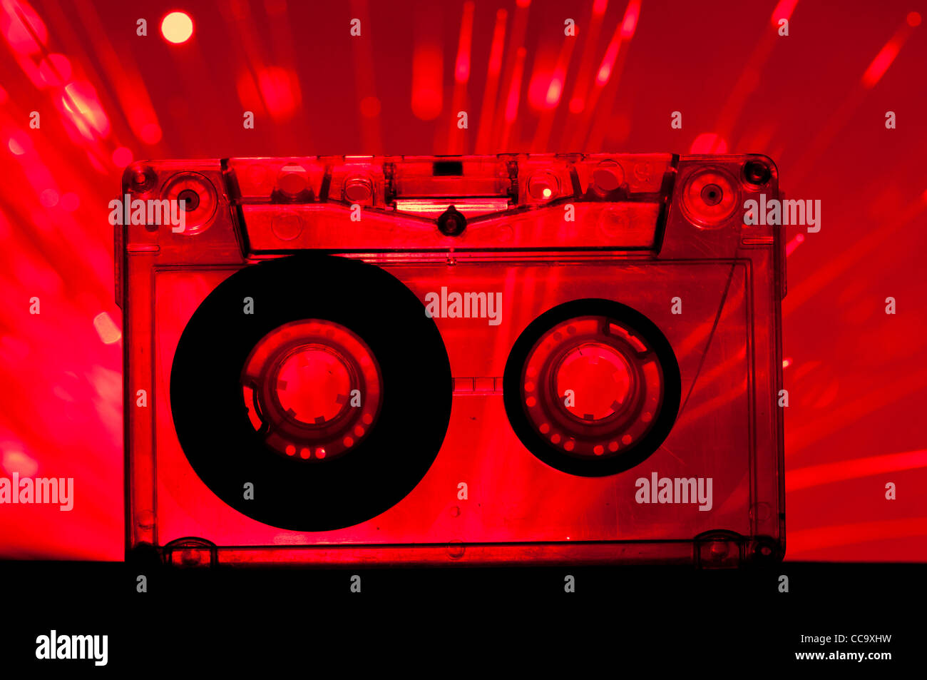 Transparent Cassette tape and red color disco lights background Stock ...