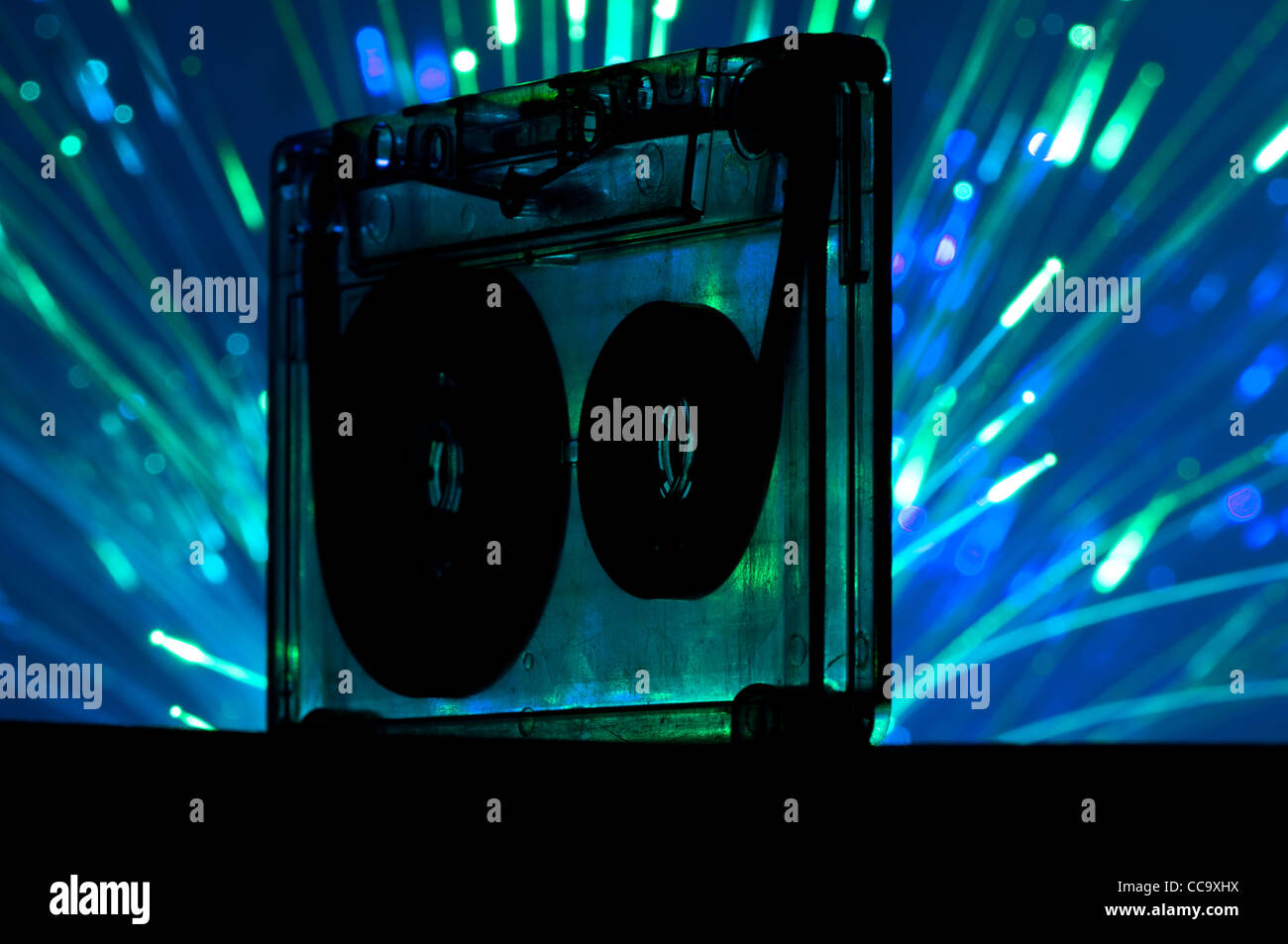 Transparent Cassette tape and blue color disco light background Stock ...