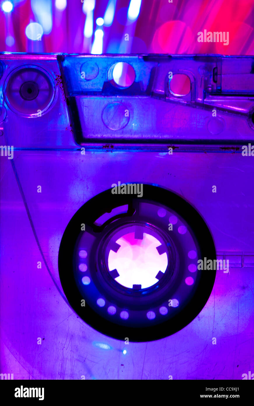 Transparent Cassette tape and blue pink color disco light background ...