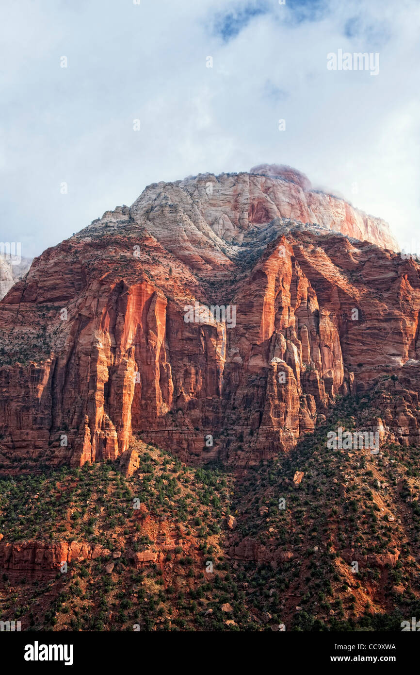 A brief clearing of the clouds reveal the East Temple rising 7,700 feet ...