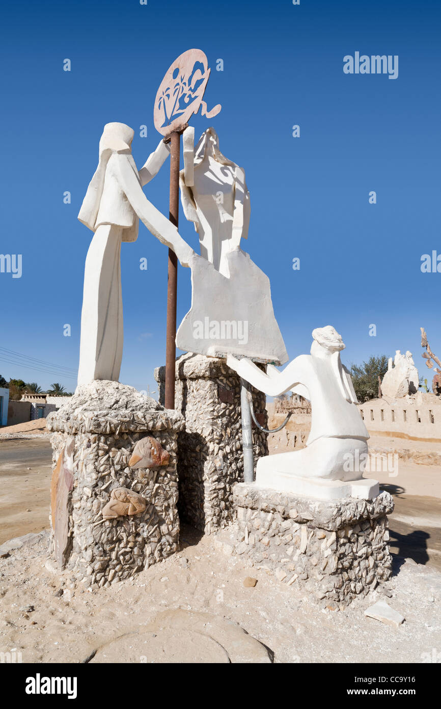 Sculpted figures on a roundabout in the middle of Farafra Oases ...