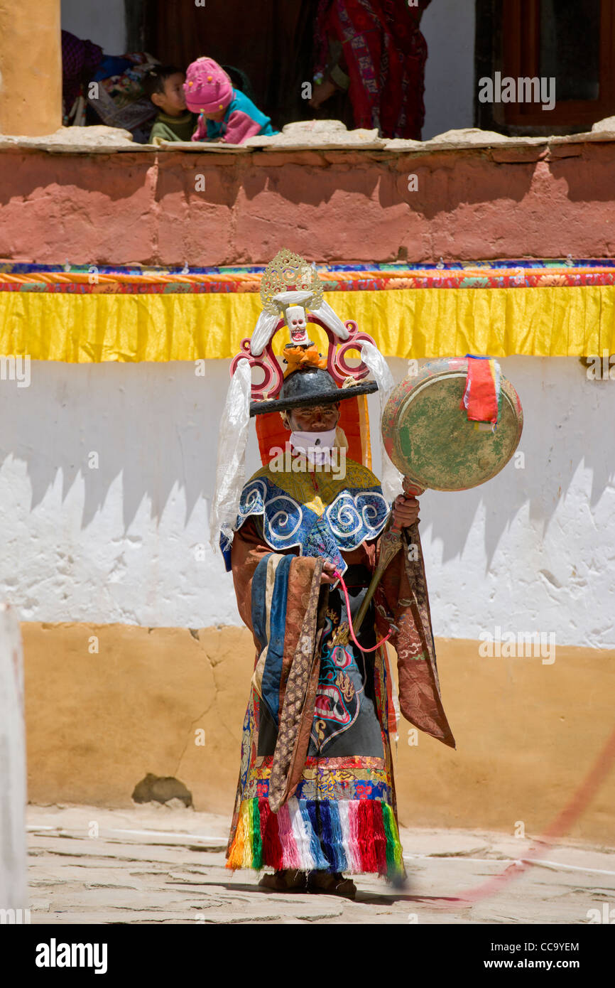 Cham dancer performing black hat dance (shana) with drum in Korzok ...