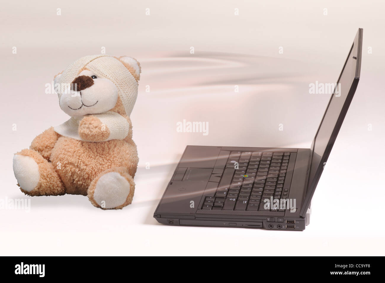 Sick Teddy Bear by his Laptop Computer Stock Photo - Alamy