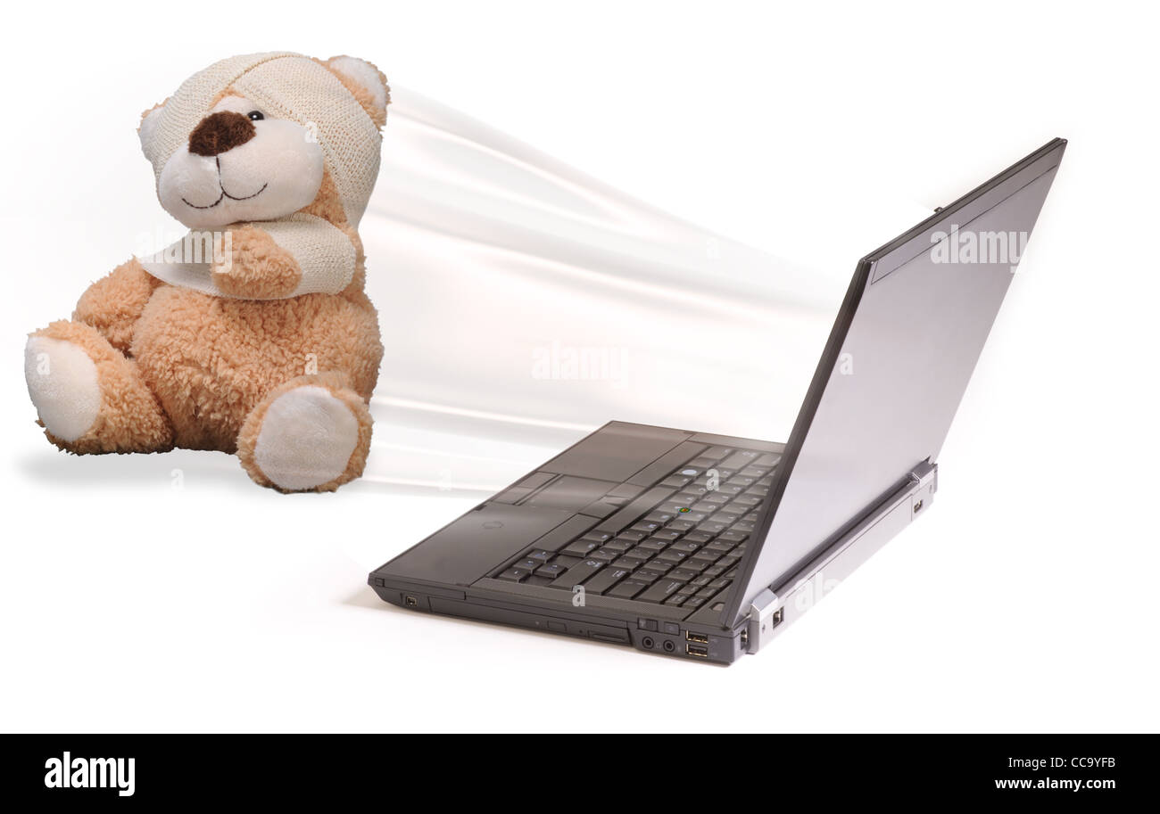 Sick Teddy Bear by his Laptop Computer Stock Photo - Alamy