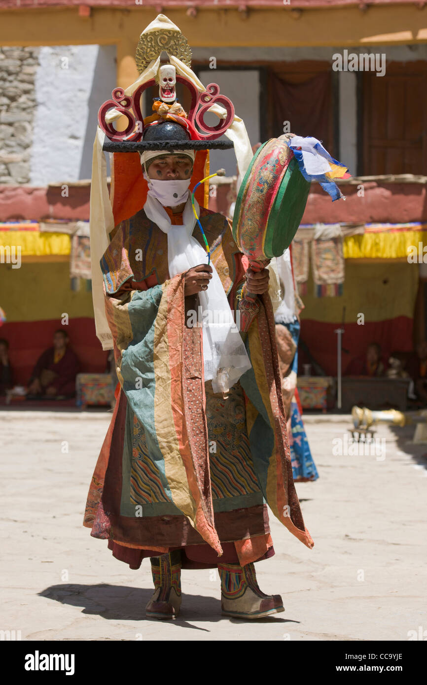 Cham dancer performing the Black Hat Dance (shana) with a drum in the ...