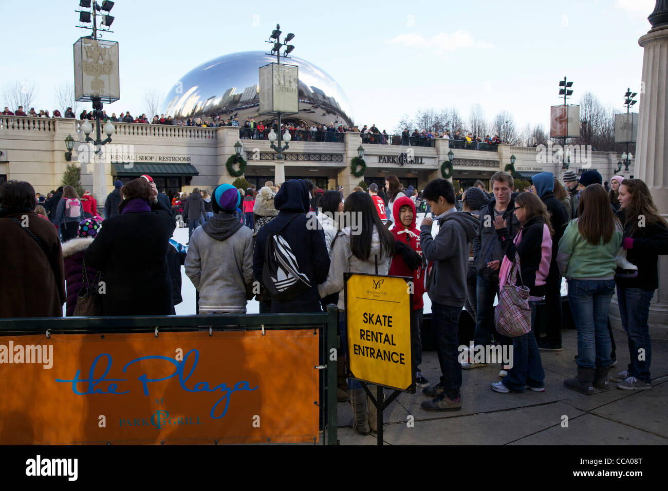 Crowd lined up for ice skate rental. Millennium Park ice rink Chicago ...