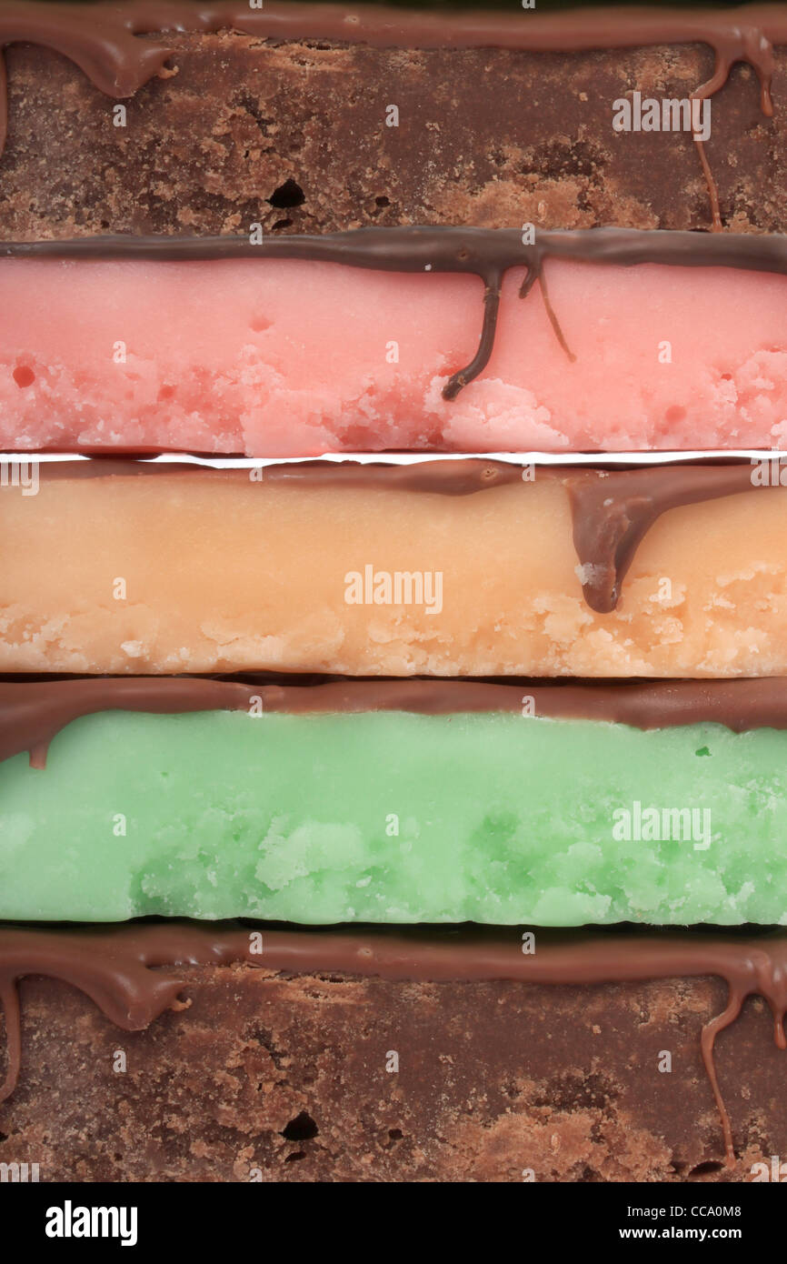 Close up of fudge bar pile in different colors and flavors covered in ...