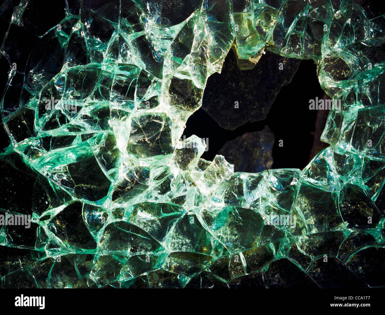 A hole broken in glass Stock Photo - Alamy