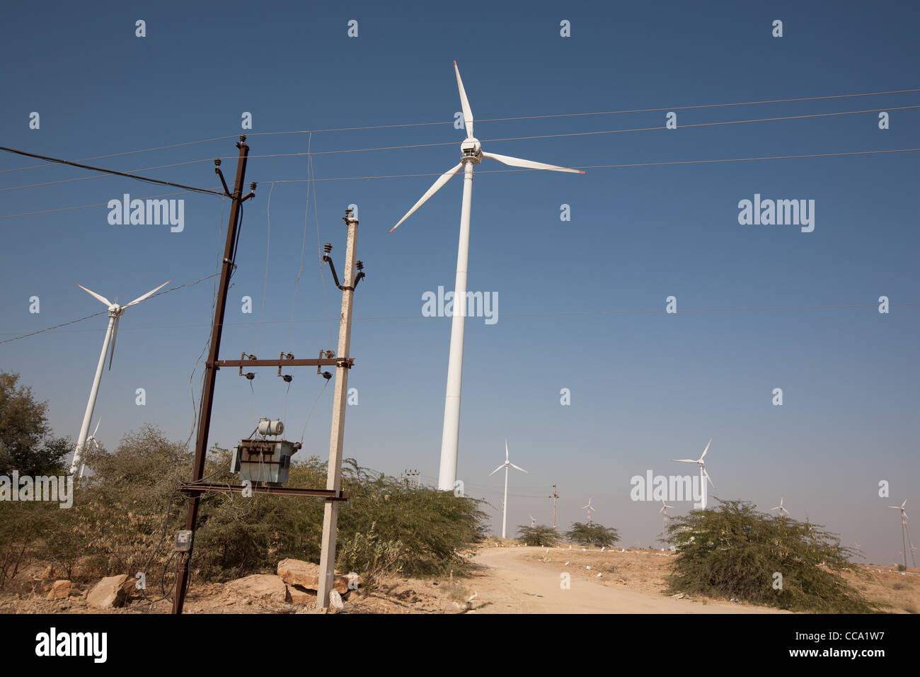 Modern wind power turbines and wind farm near Bada Bagh mausoleums for ...