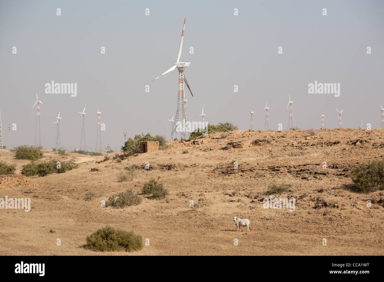 Modern wind power turbines and wind farm near Bada Bagh mausoleums for ...