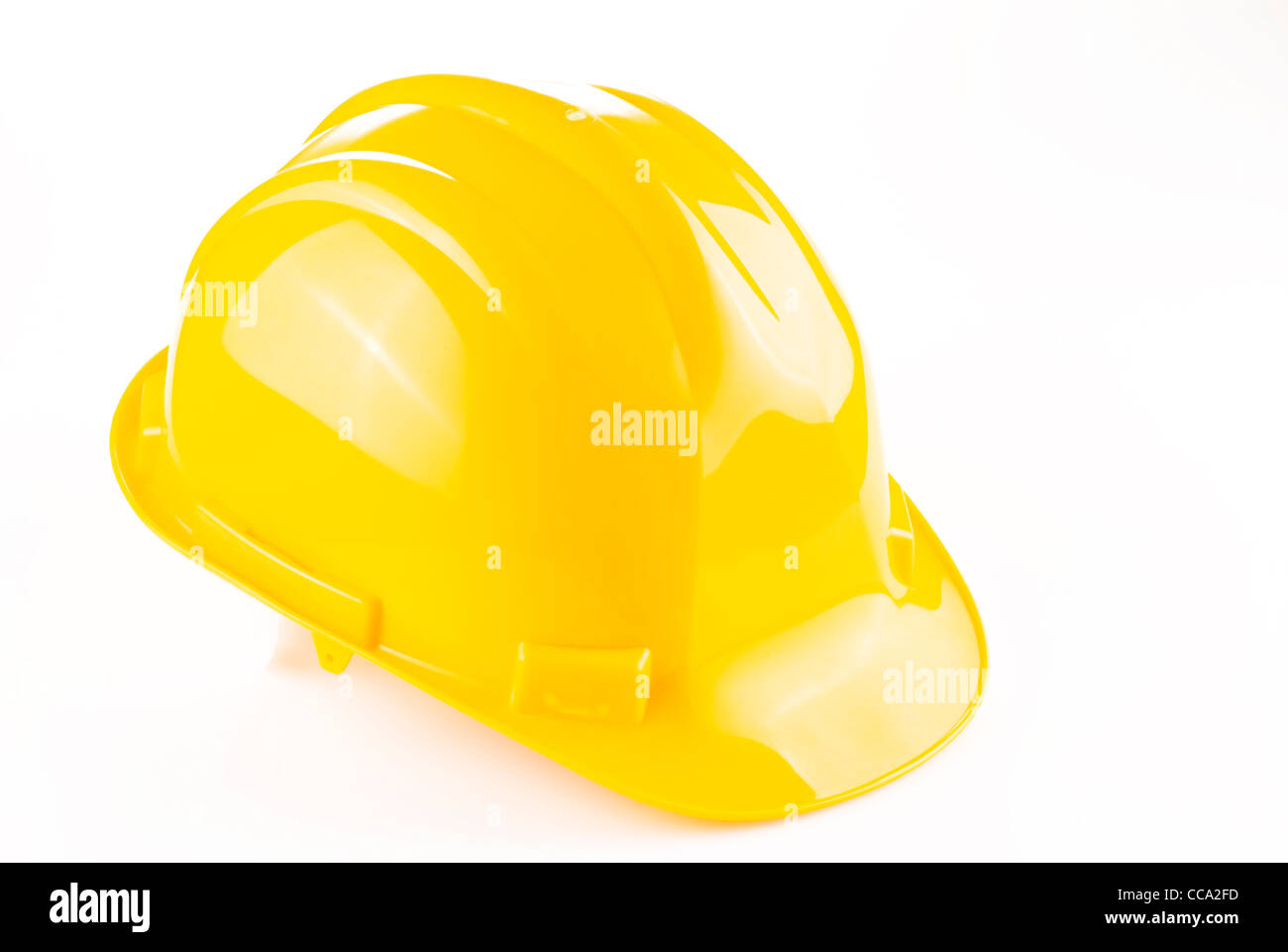 Yellow safety hat isolated over white background Stock Photo - Alamy