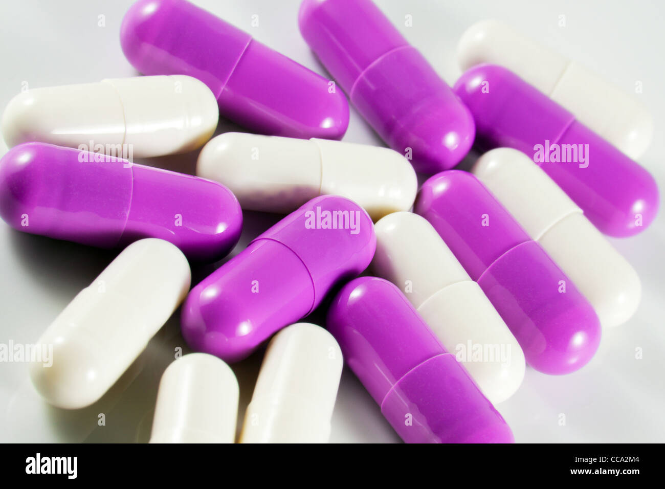 white and purple pills Stock Photo - Alamy