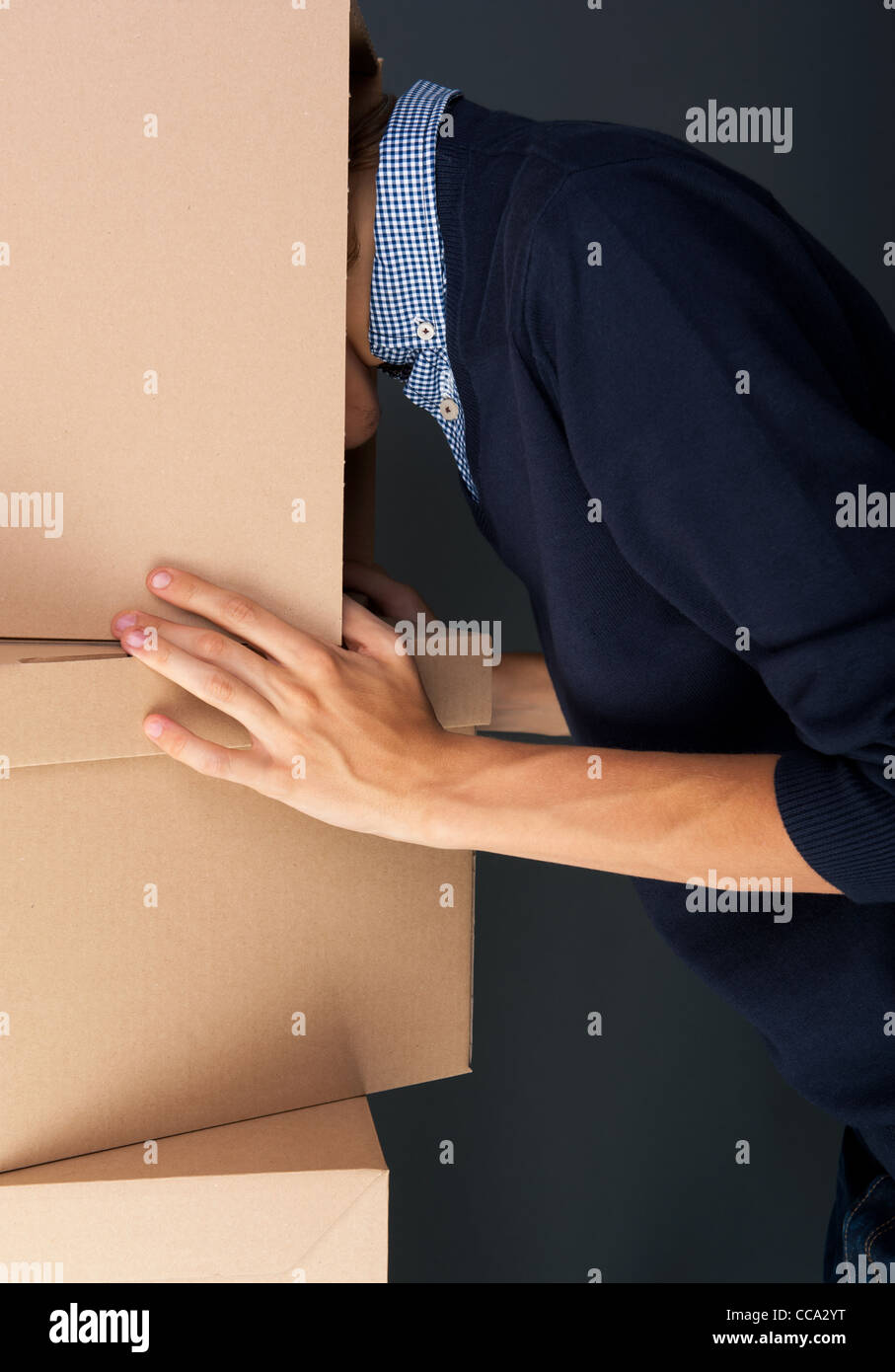 Portrait of anonymous young man with his head inside box Stock Photo ...