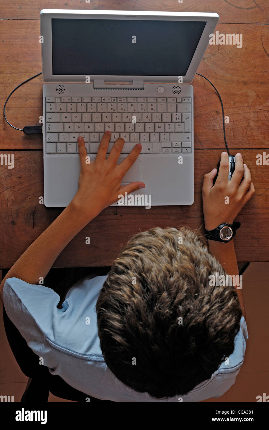 Children 11 using laptop hi-res stock photography and images - Alamy