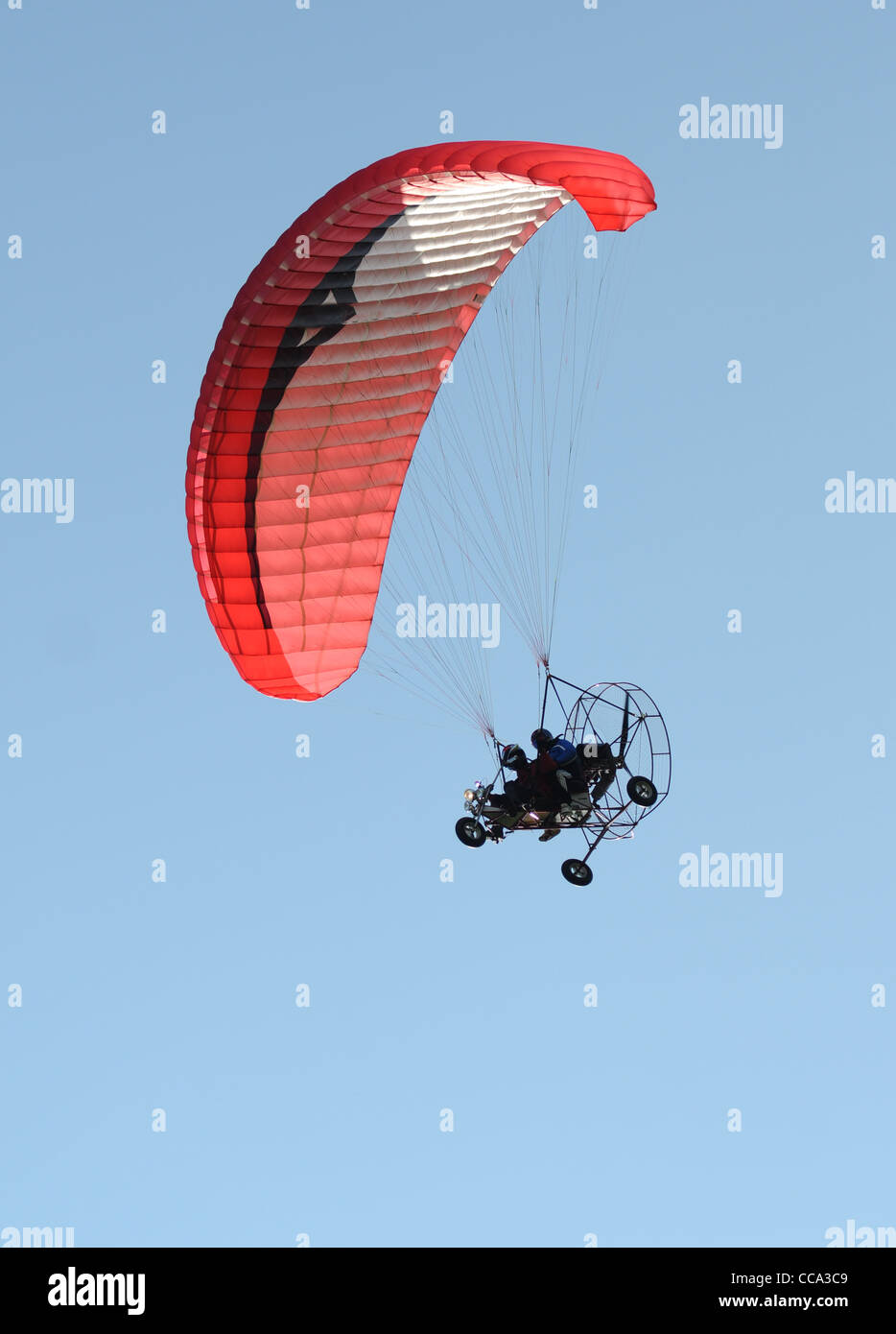 Moto paraglider on blue sky, autumn landscape Stock Photo - Alamy