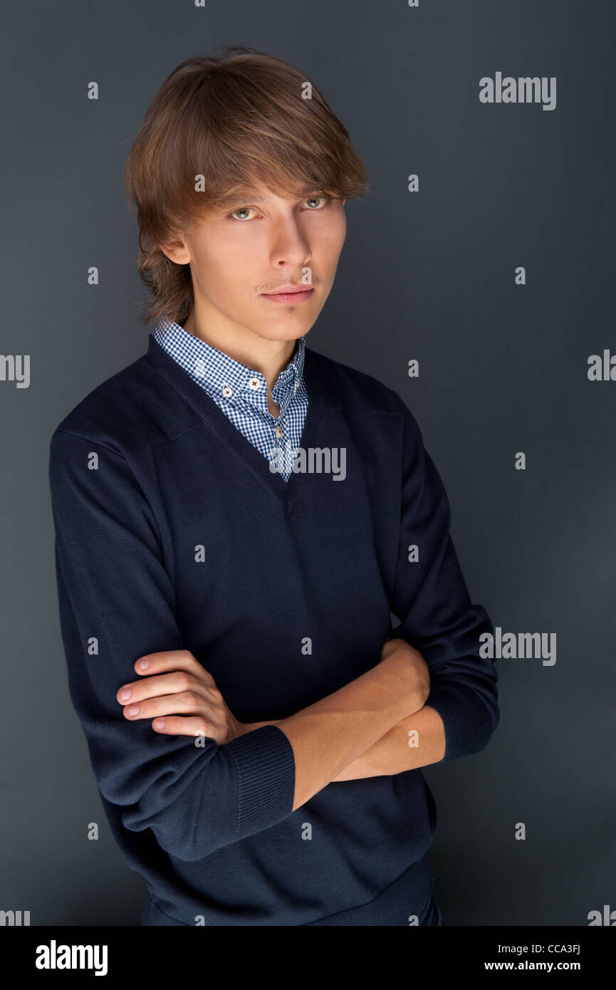 Portrait of a business man against grey background. Studio shot Stock ...