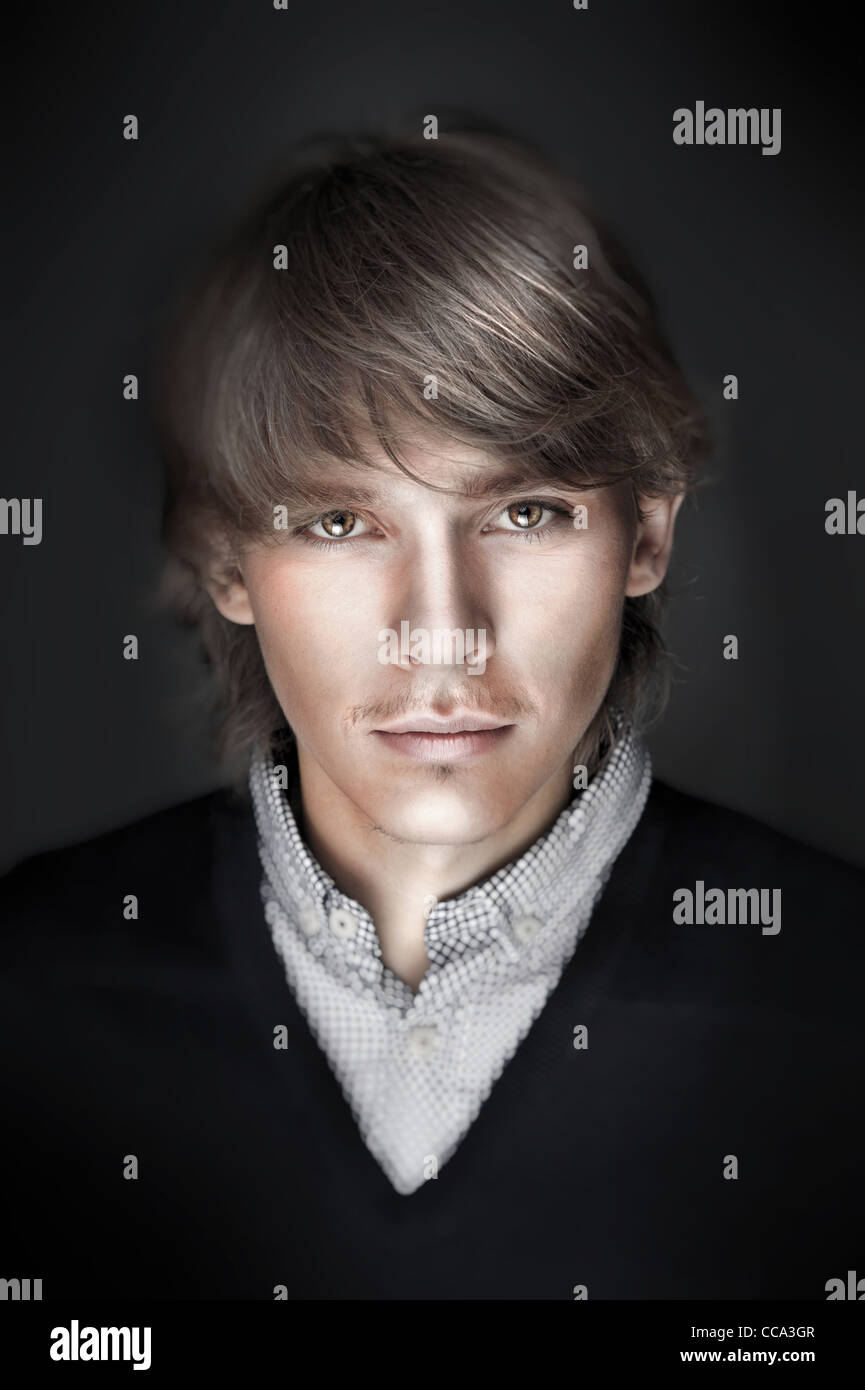 Portrait of young esquire man with smart and wise look. Looking at ...