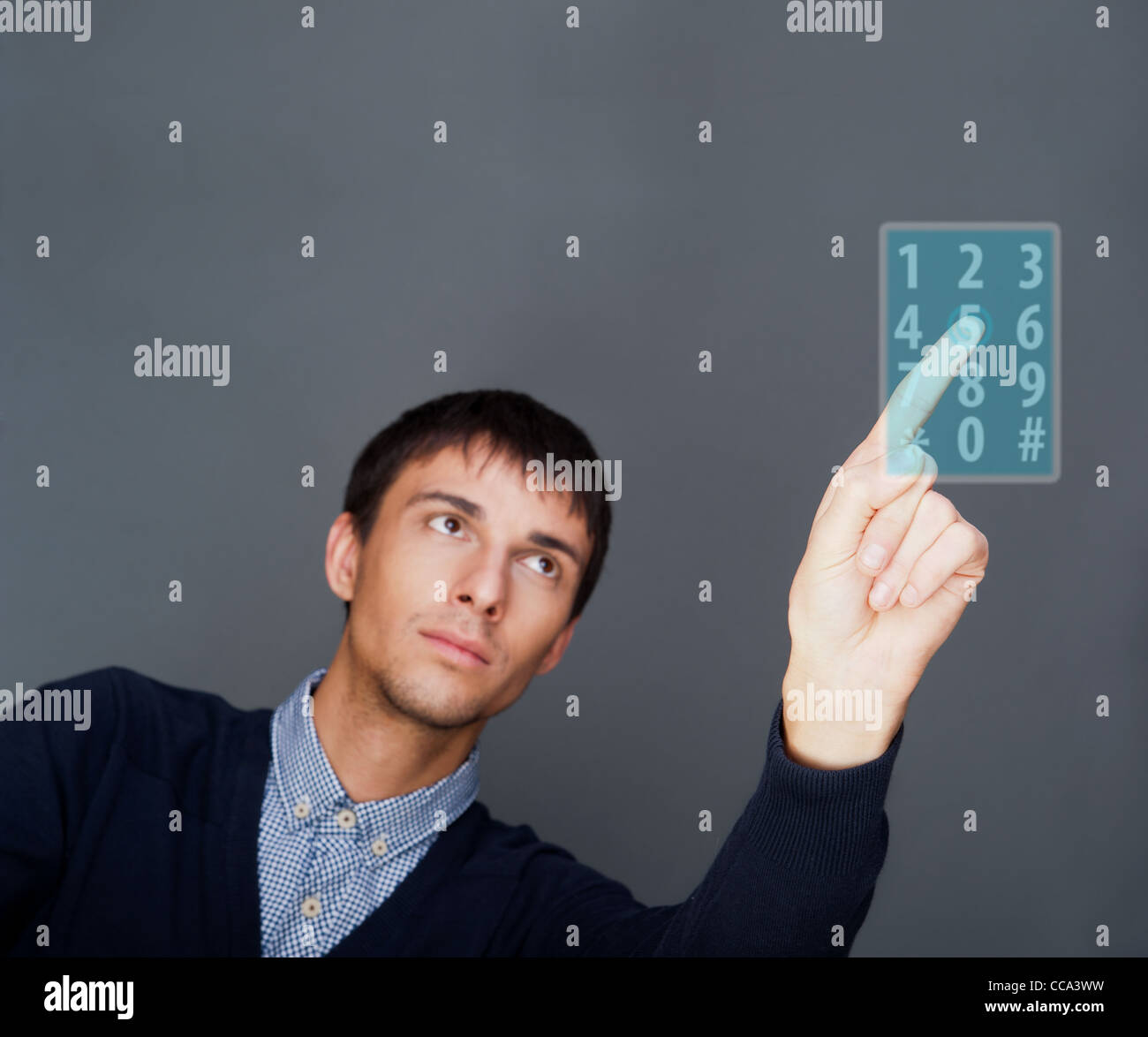 Portrait of adult business man pressing a touchscreen button while ...