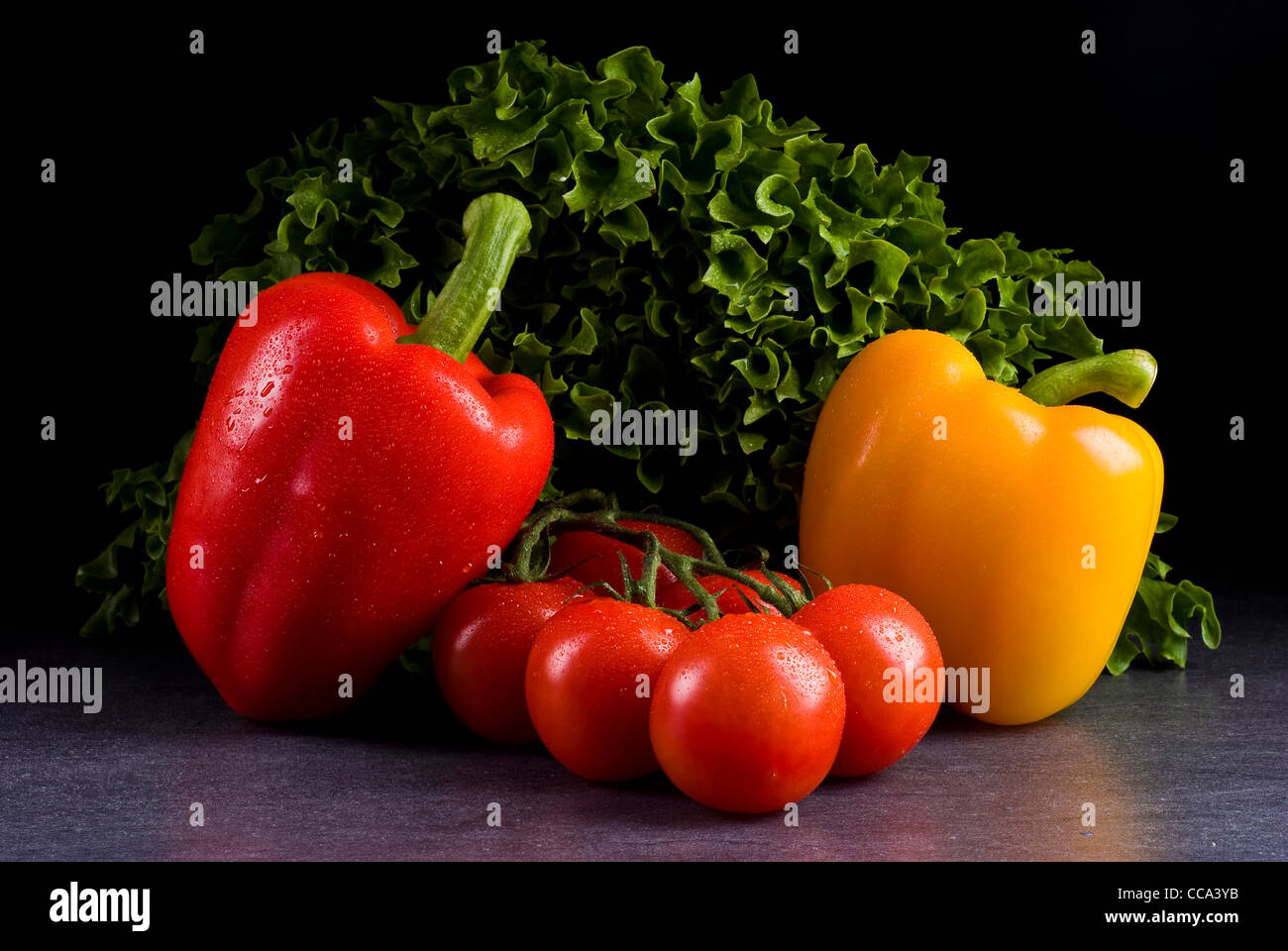 Fresh vegetables on a black background Stock Photo - Alamy