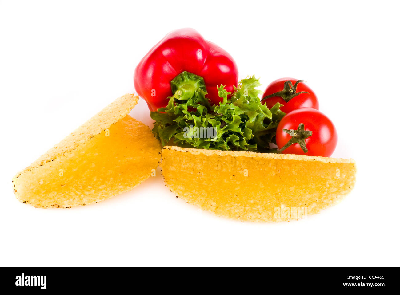 Taco shells with vegetables isolated over white background Stock Photo ...