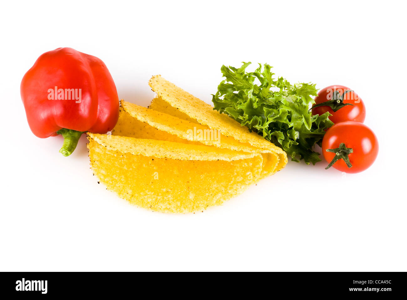 Taco shells with vegetables isolated over white background Stock Photo ...