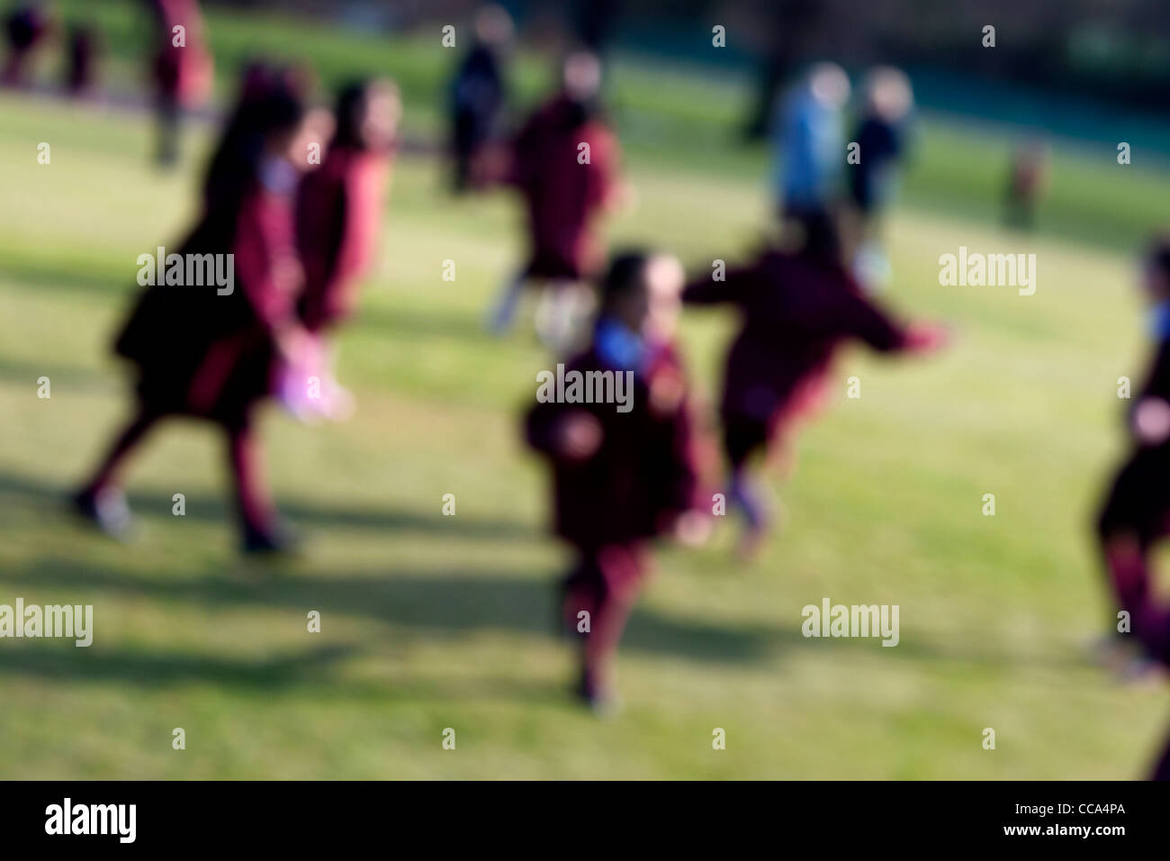Primary school children play during lunch time on a school playing ...