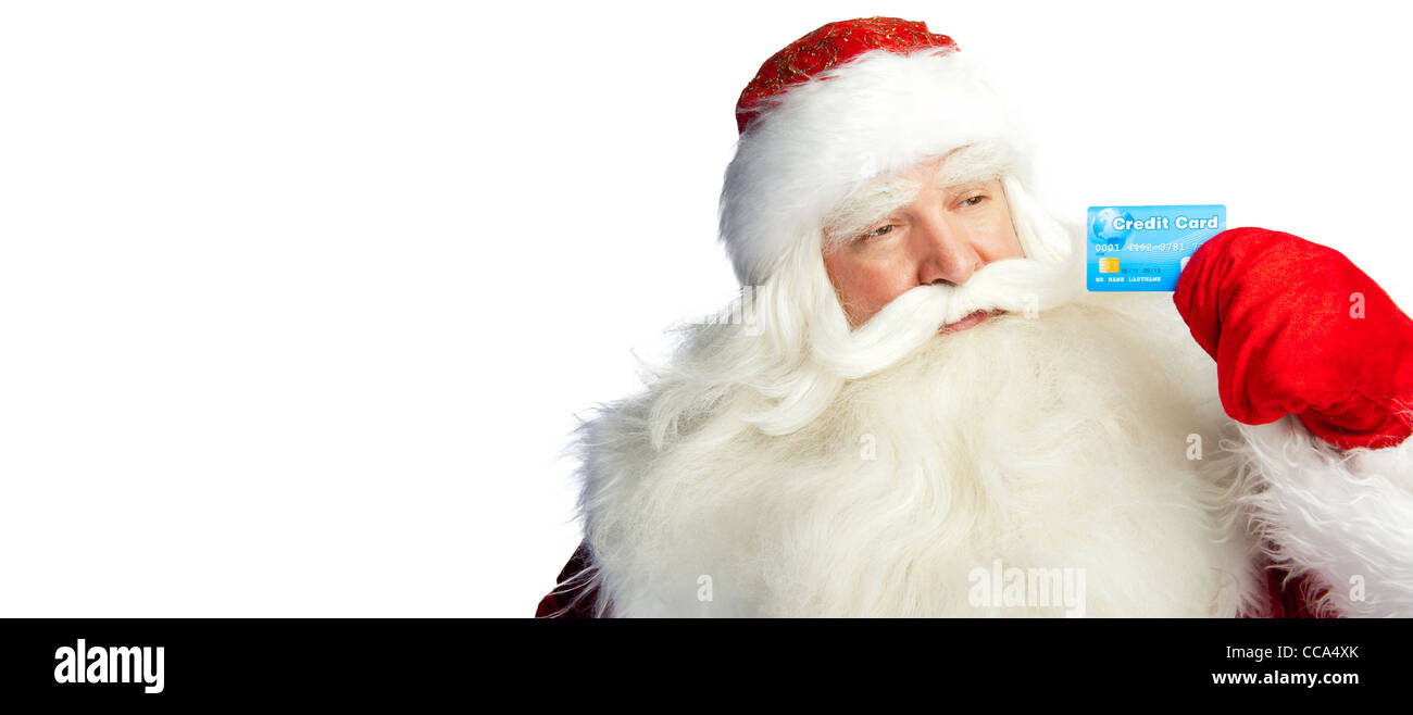 Traditional Santa Claus holding and sowing credit card while giving a ...