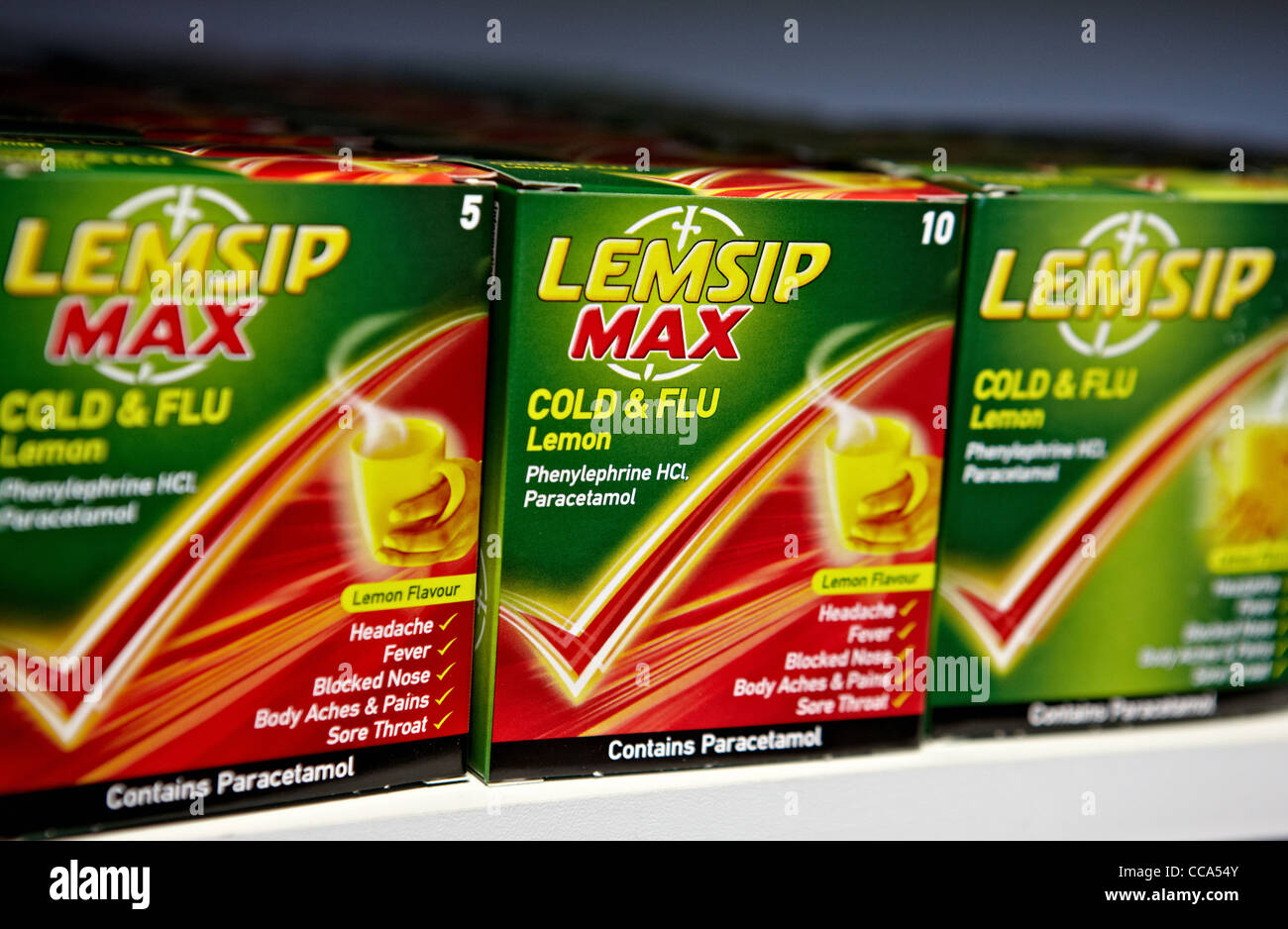 Lemsip packets on a supermarket shelf. Lemsip provides cold and flu ...