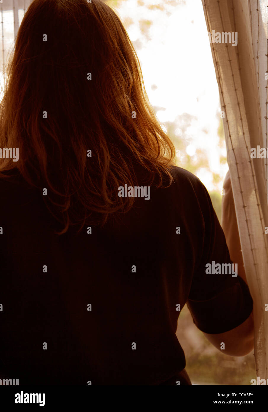Woman At Window - Back View Stock Photo - Alamy