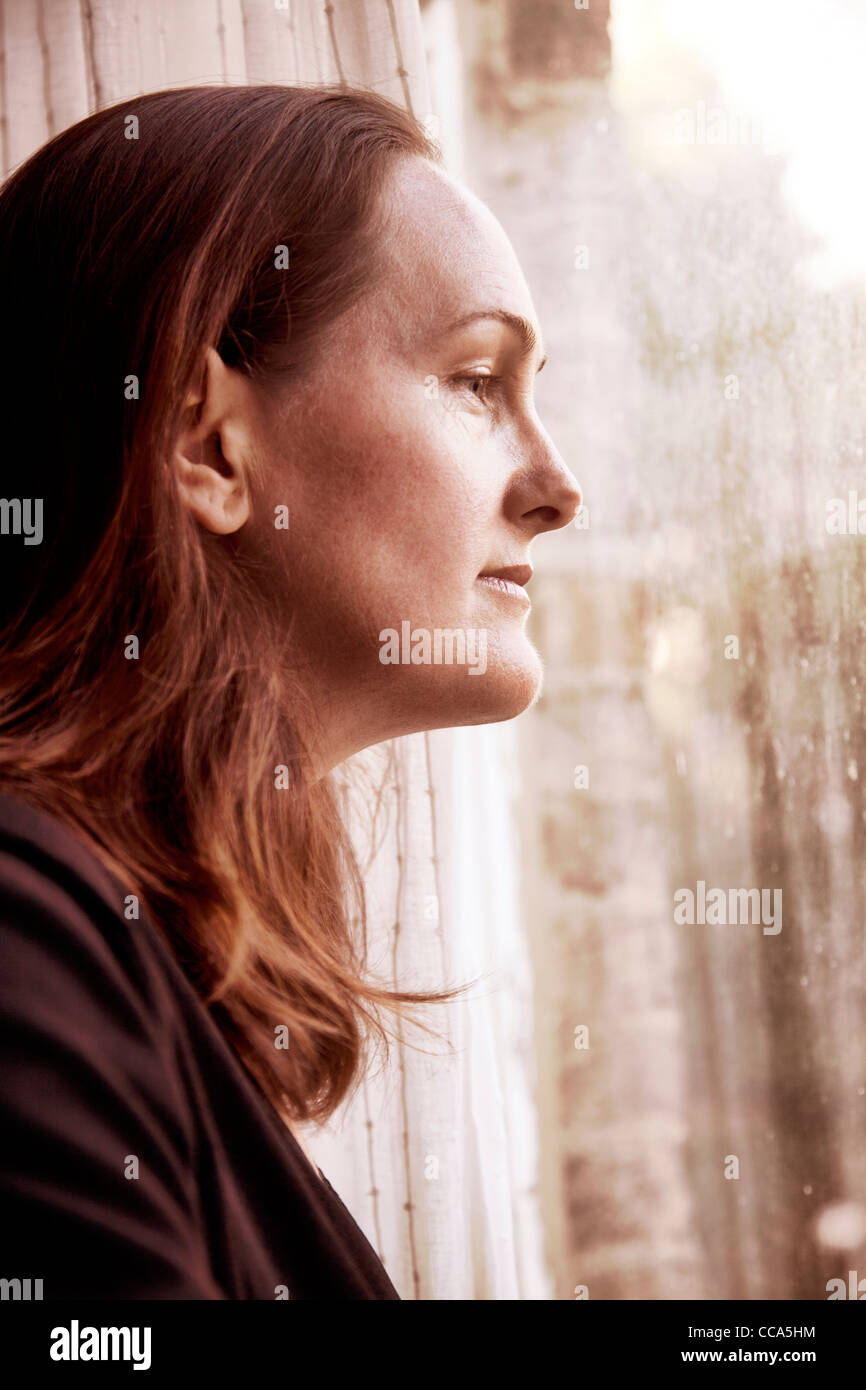 Woman At Window Stock Photo - Alamy