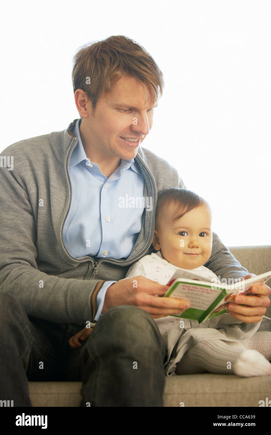 Father Reading Picture Book For Baby Daughter Stock Photo - Alamy