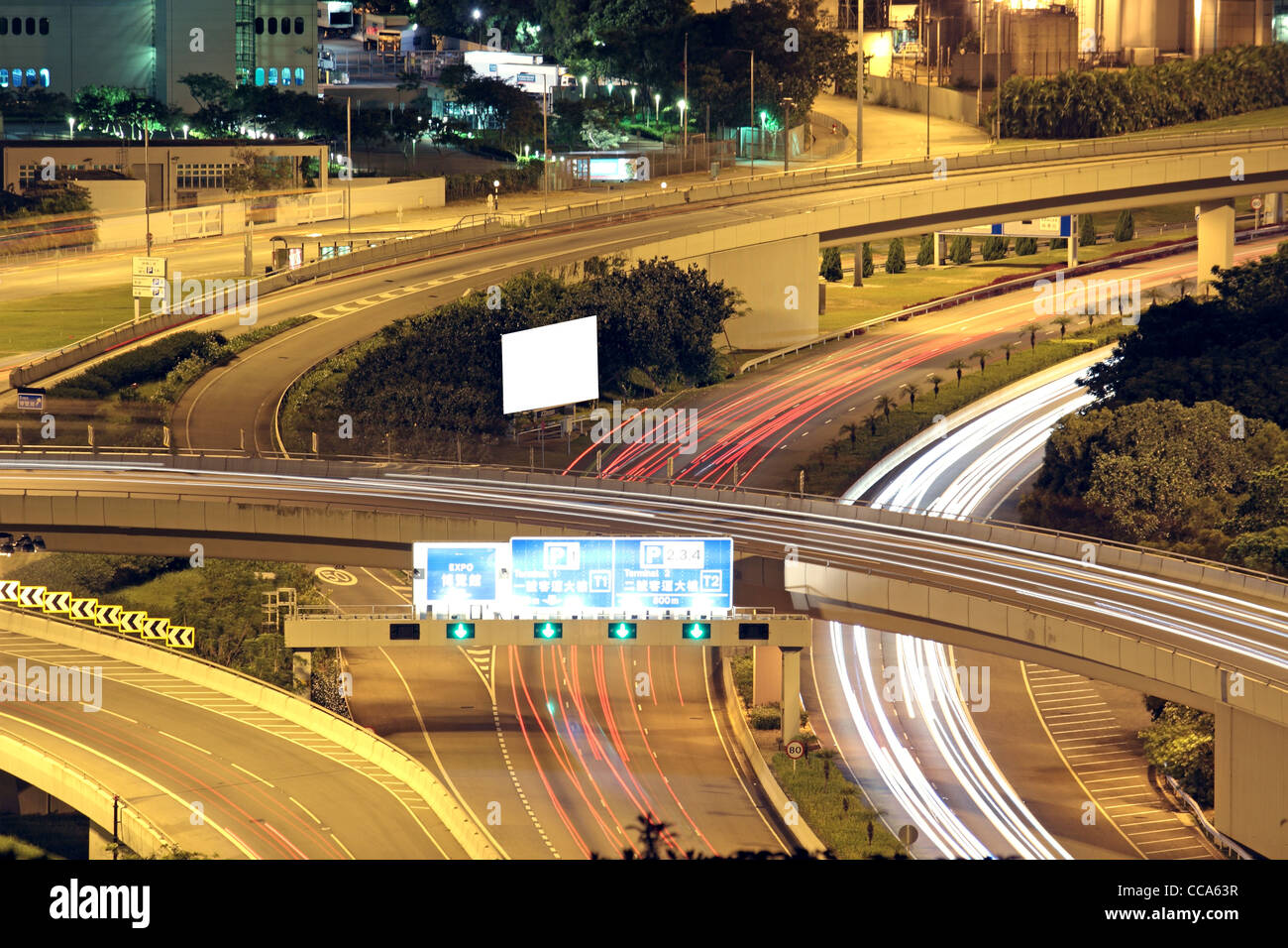 Freeway in night with cars light in modern city Stock Photo - Alamy
