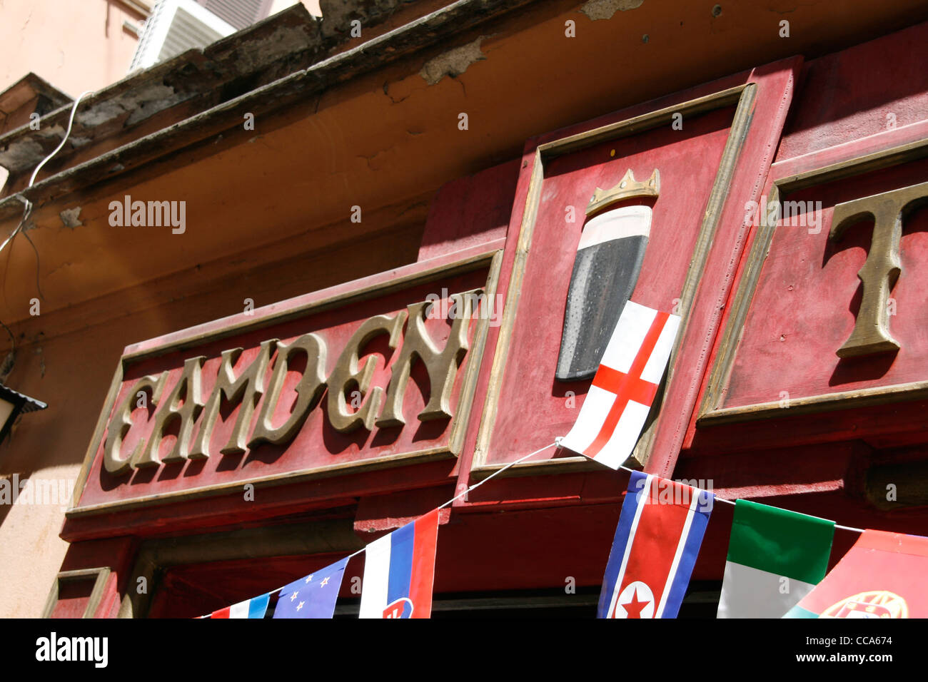 one pub sign with flag in rome italy Stock Photo - Alamy
