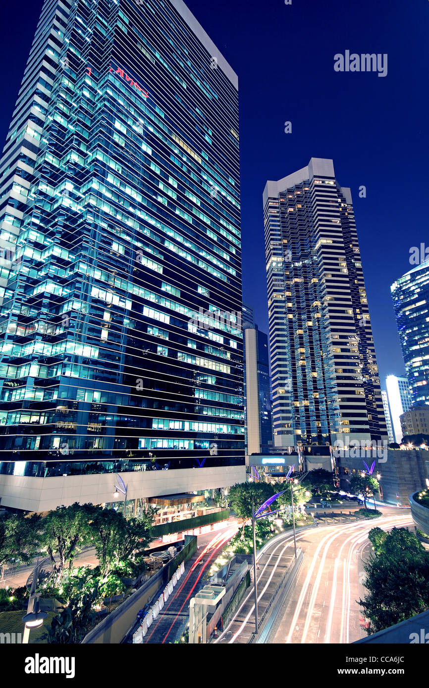 Tall office buildings by night Stock Photo - Alamy