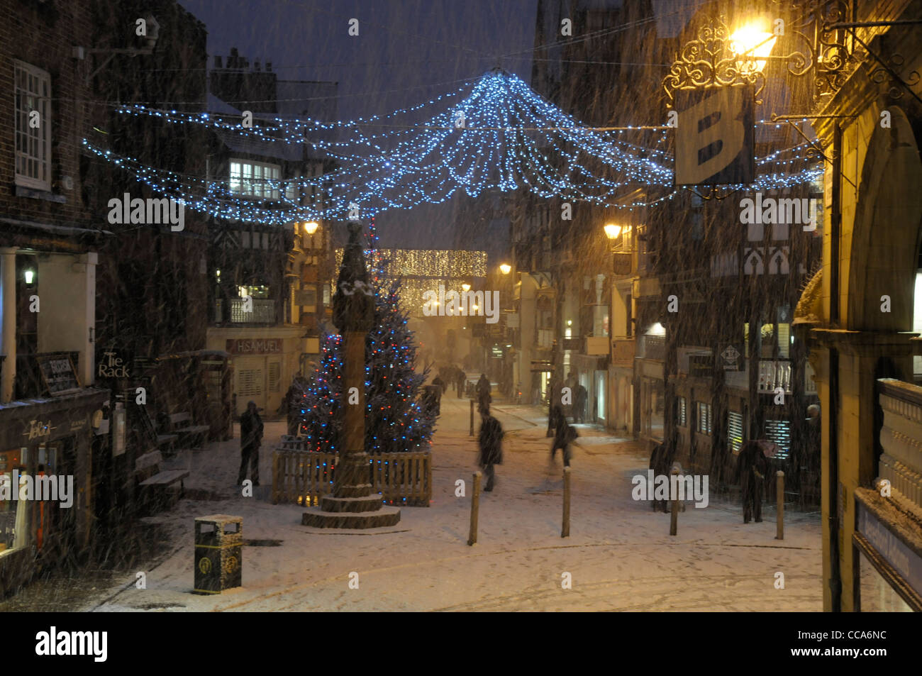 The Roman City of Chester at night during the winter covered in snow ...