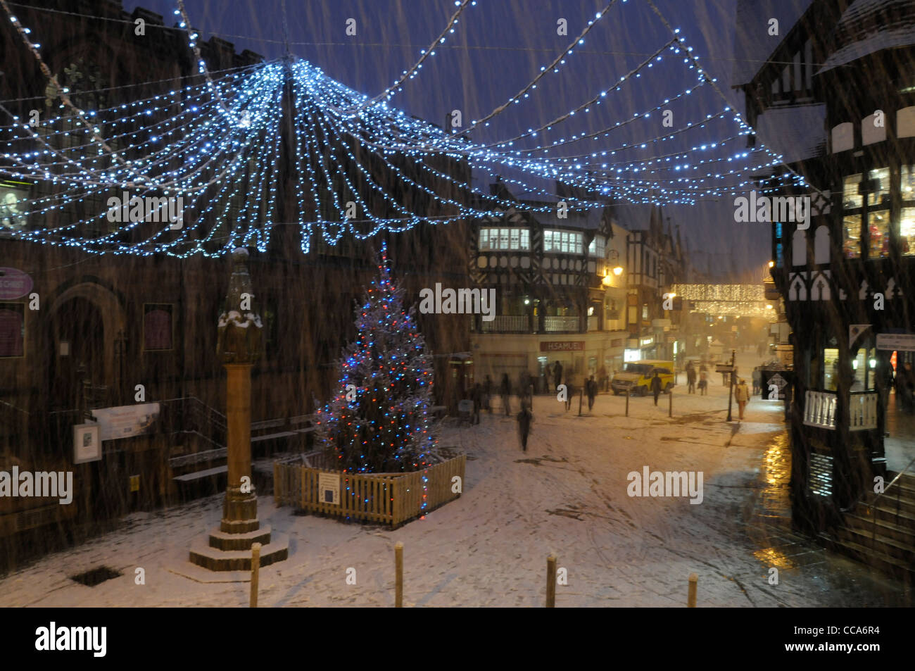 The Roman City of Chester at night during the winter covered in snow ...