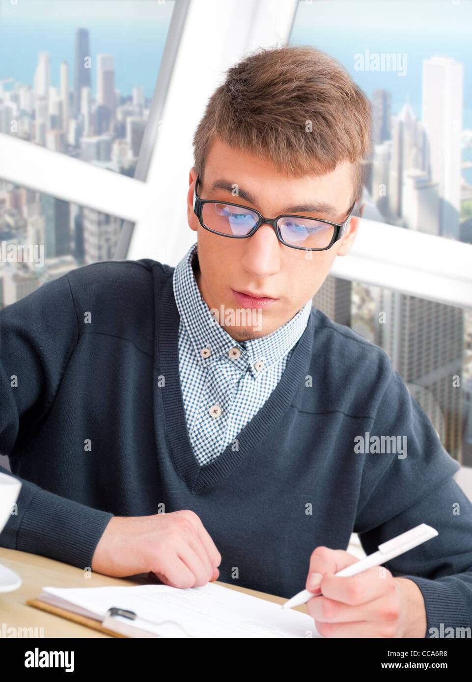 Young male student doing homework in his room at home Stock Photo - Alamy