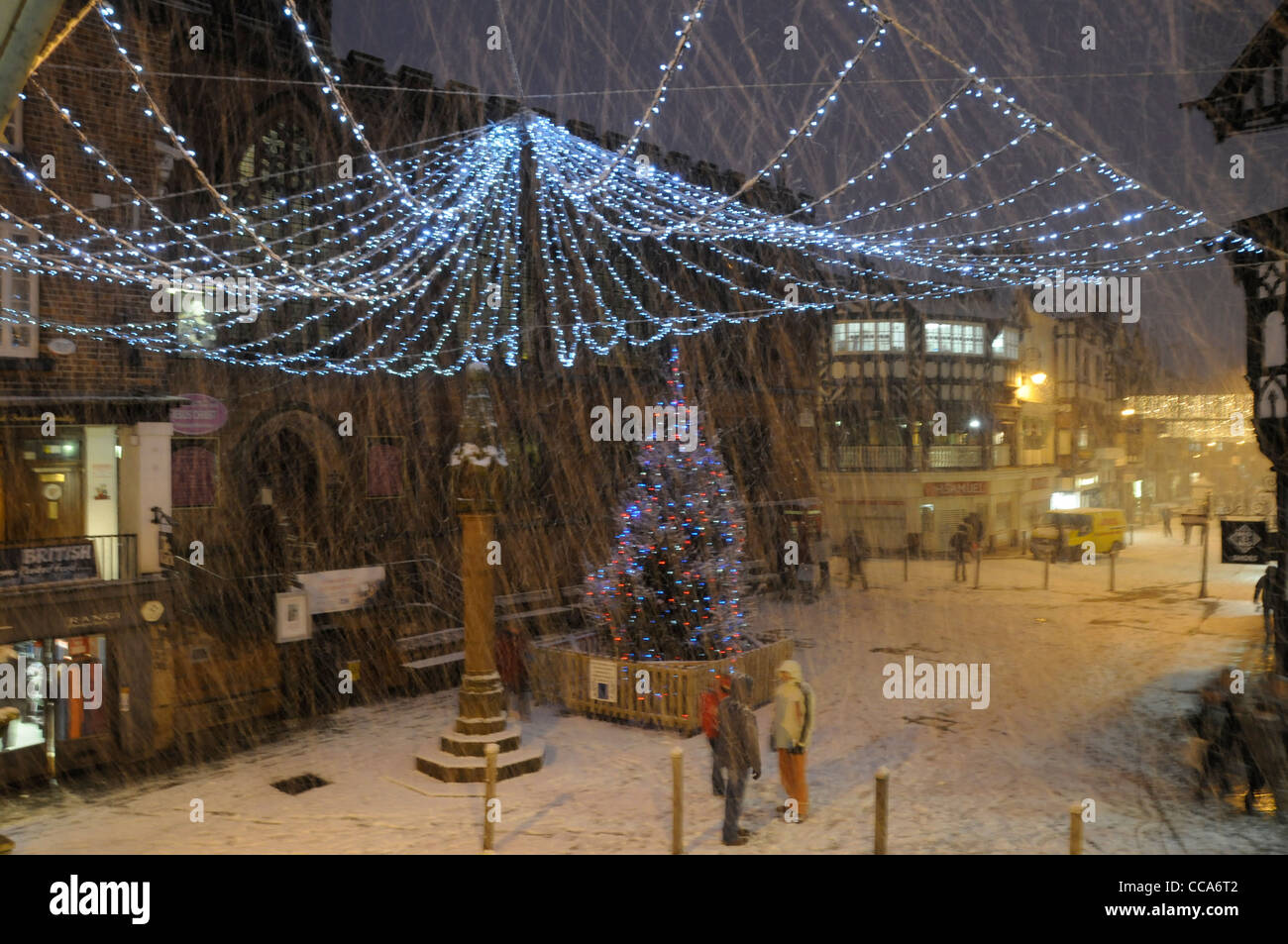 The Roman City of Chester at night during the winter covered in snow ...