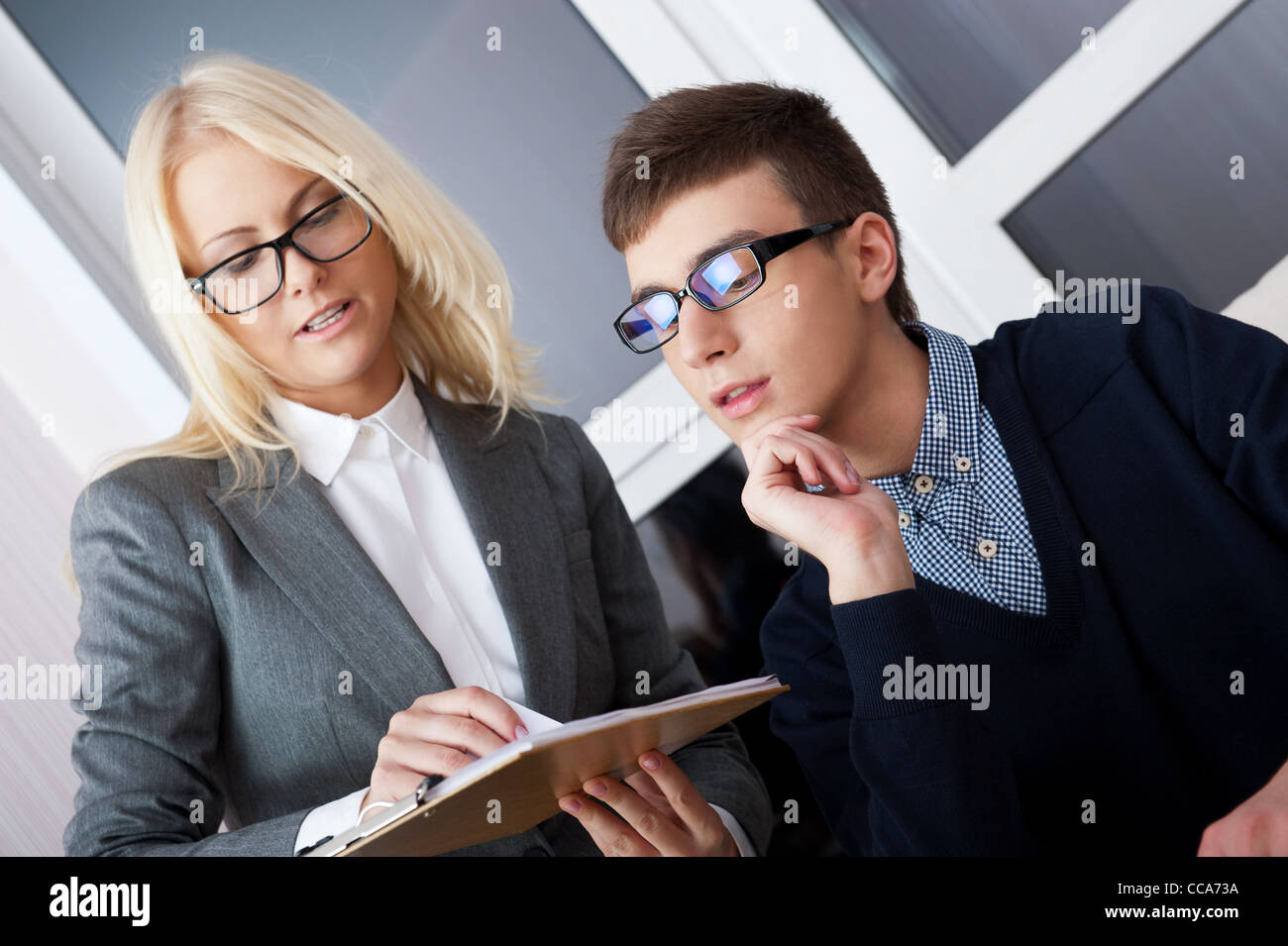 Young and good-looking business people are working in the office Stock ...