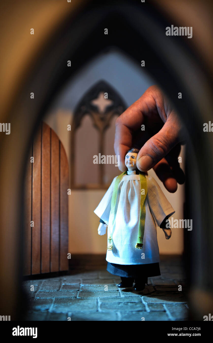 A vicar by Wooside Dolls is placed inside 'All Saints Church' by ...