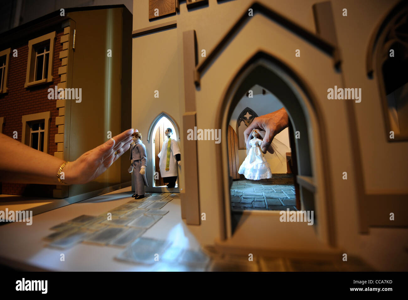 A vicar by Woodside Dolls with the groom before a wedding scene inside ...
