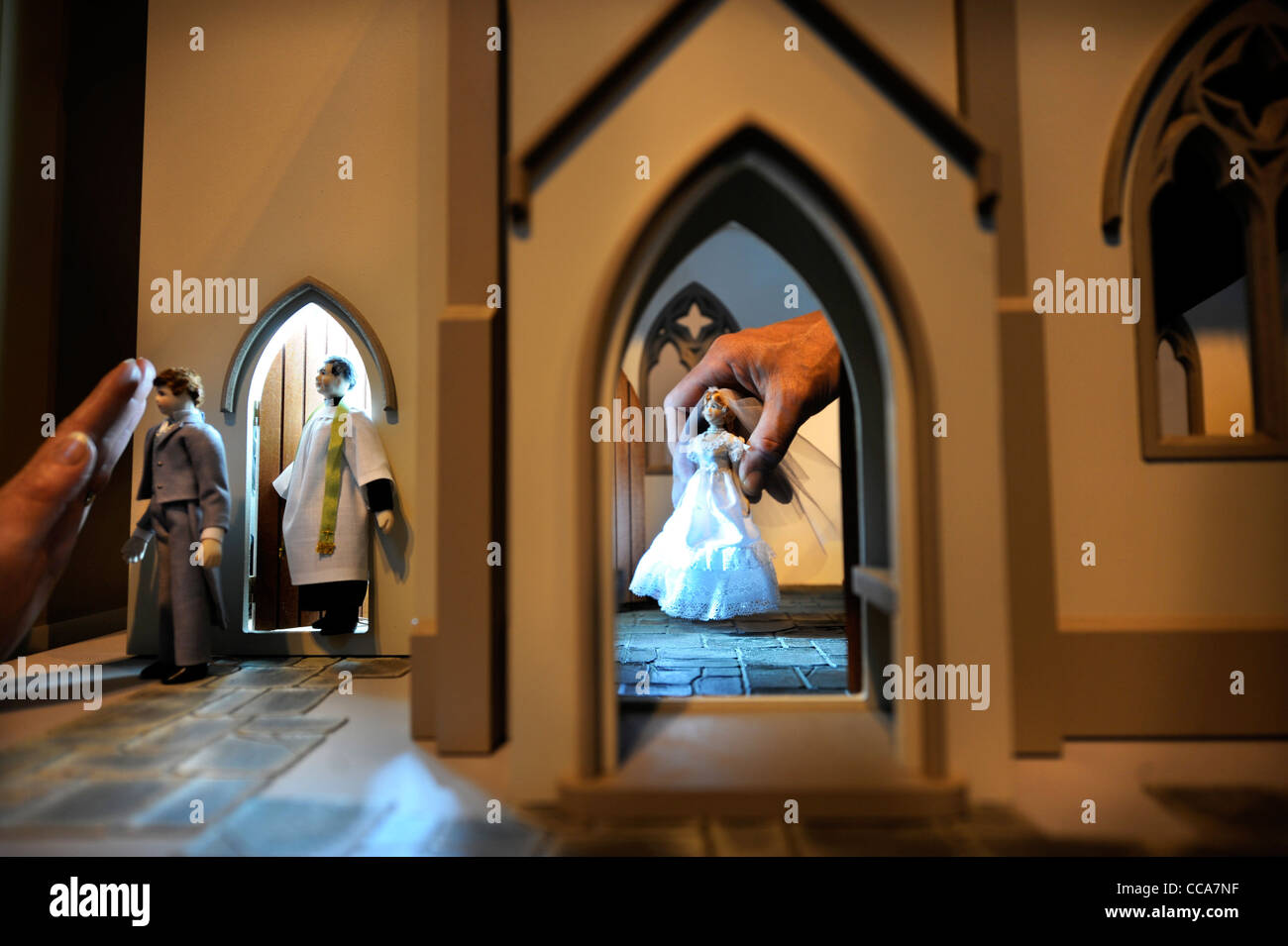 A vicar by Woodside Dolls with the groom before a wedding scene inside ...
