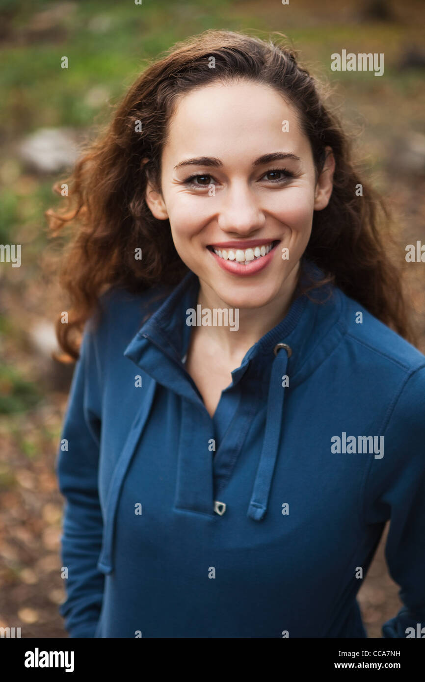 Young woman in forest smiling, portrait Stock Photo - Alamy