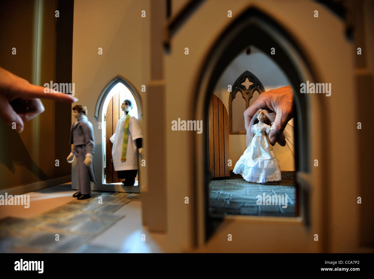 A vicar by Woodside Dolls with the groom before a wedding scene inside ...